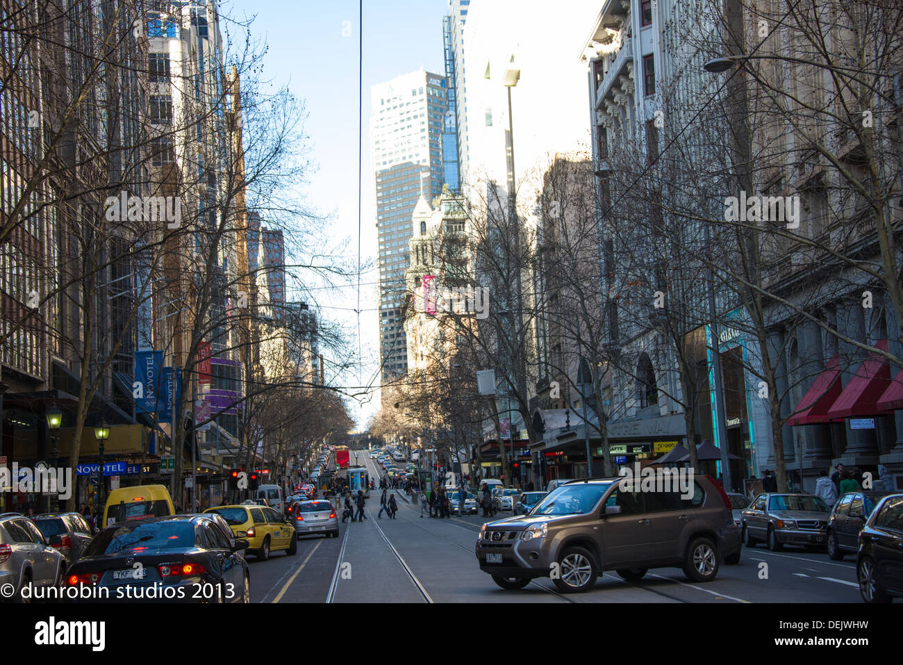 collins Street Melbourne with traffic tram lines and buildings looking ...