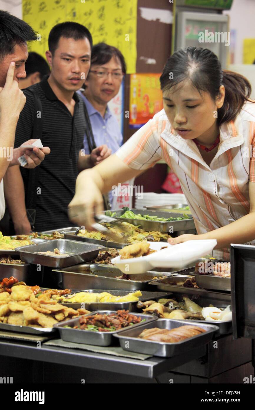 Lady serving a customer hi-res stock photography and images - Alamy