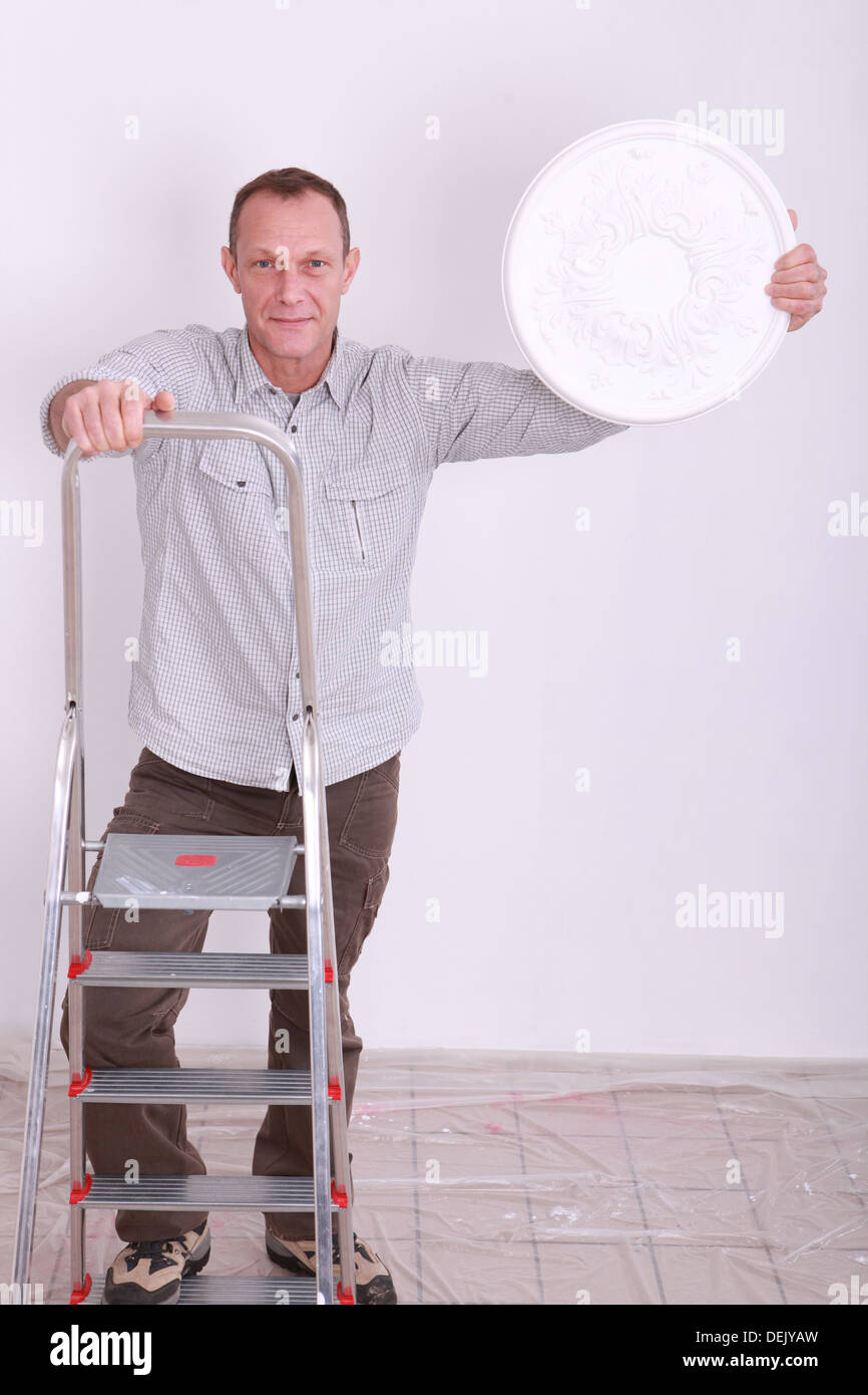 Man climbing step-ladder Stock Photo - Alamy