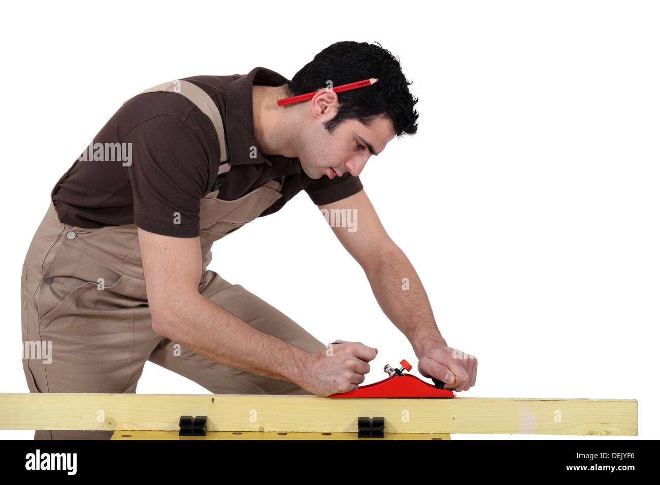 Carpenter using a plane Stock Photo - Alamy