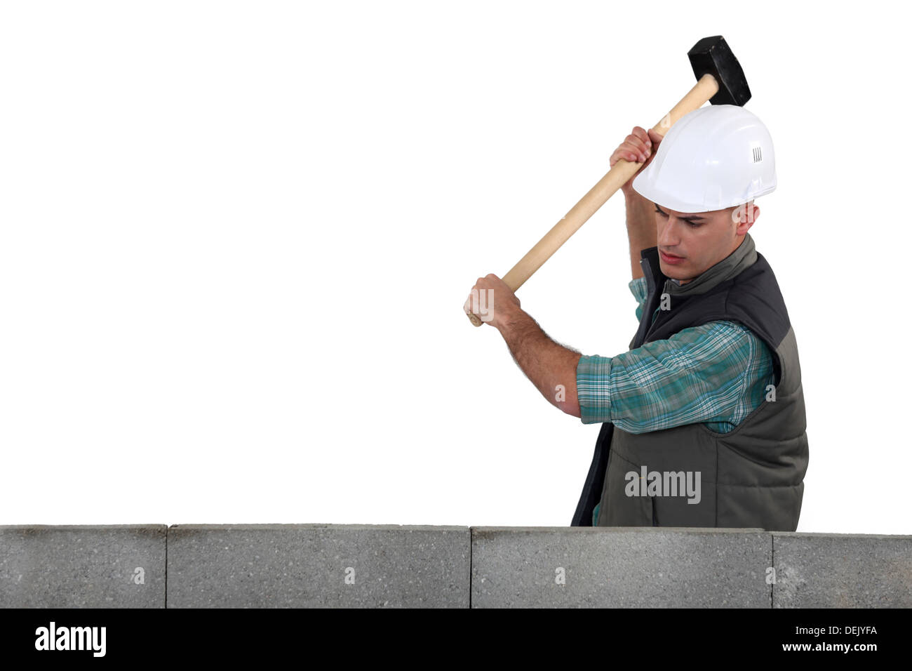 Tradesman using a mallet Stock Photo - Alamy
