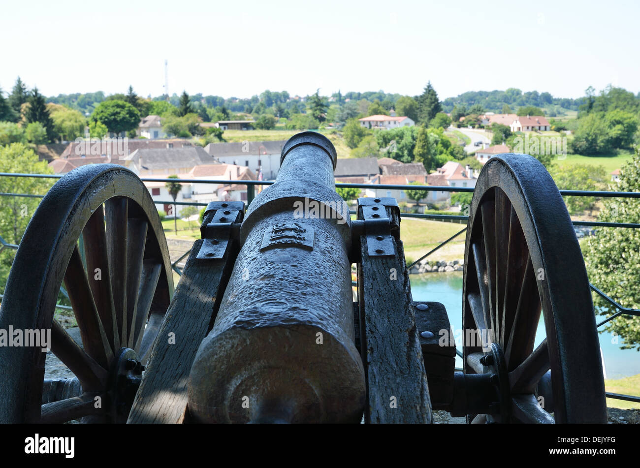 An old gun above the European town Stock Photo - Alamy