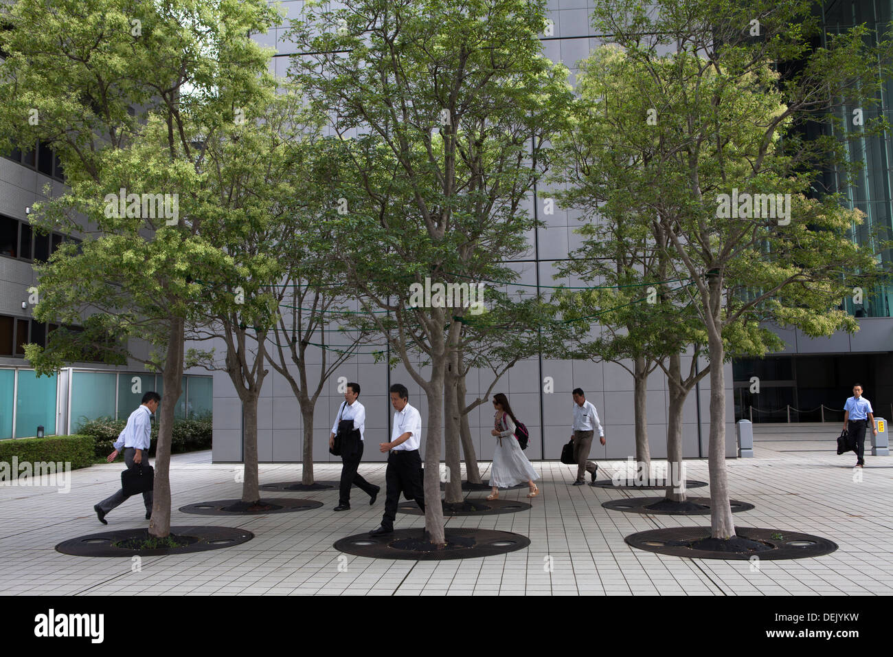 Japanese employees walk towards their office Stock Photo - Alamy