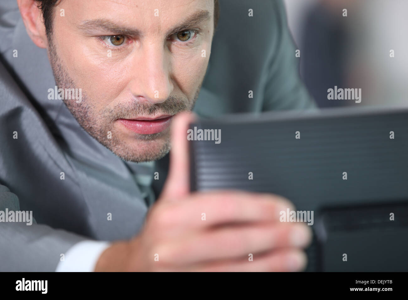 Man adjusting screen Stock Photo - Alamy