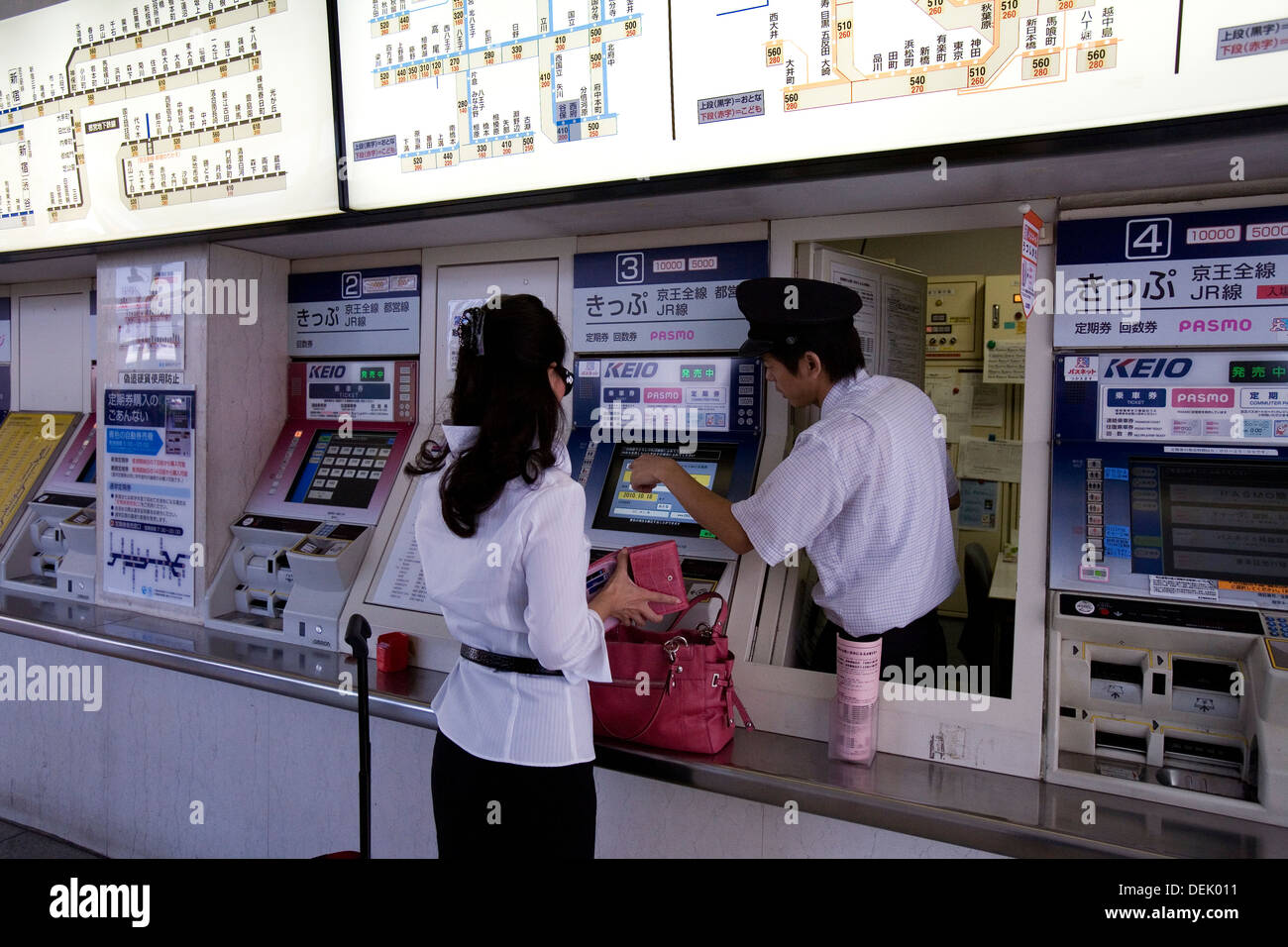 Buying tickets at a subway station Stock Photo - Alamy