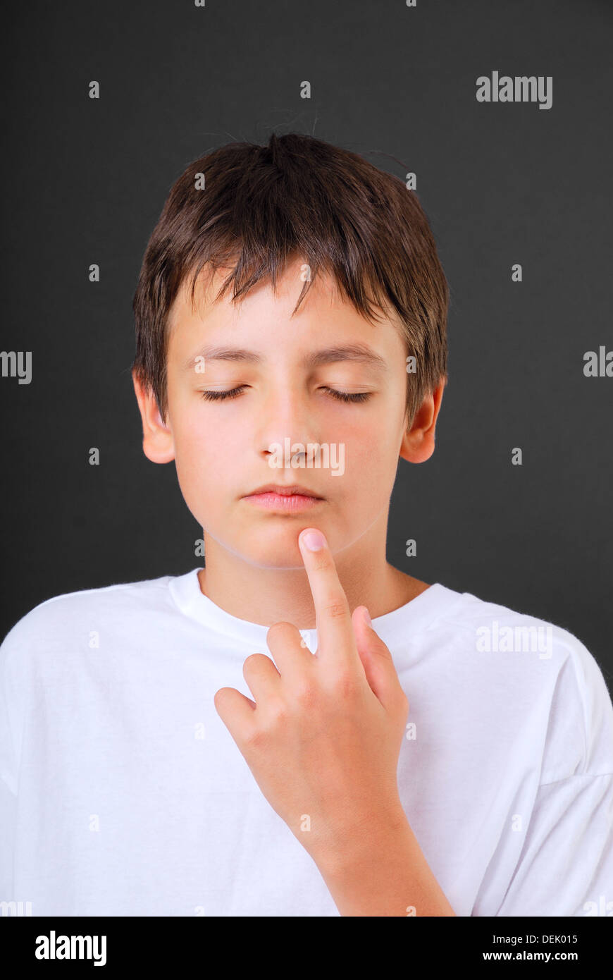 Teenage boy thinking Stock Photo - Alamy
