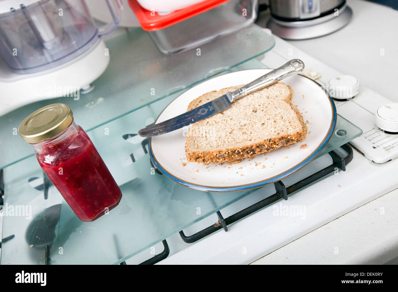 Baked bread and jam bottle on kitchen counter Stock Photo - Alamy
