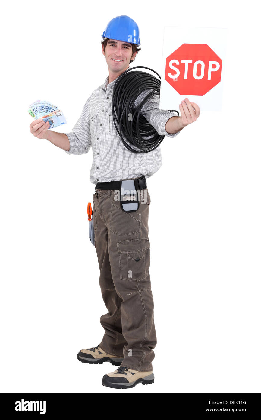 Electrical workerholding stop sign Stock Photo - Alamy