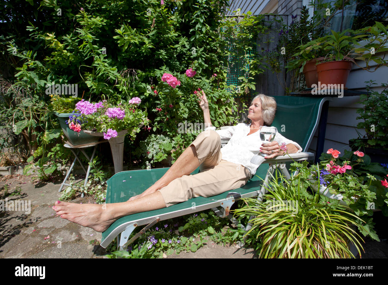 Reclining chair woman hi-res stock photography and images - Alamy
