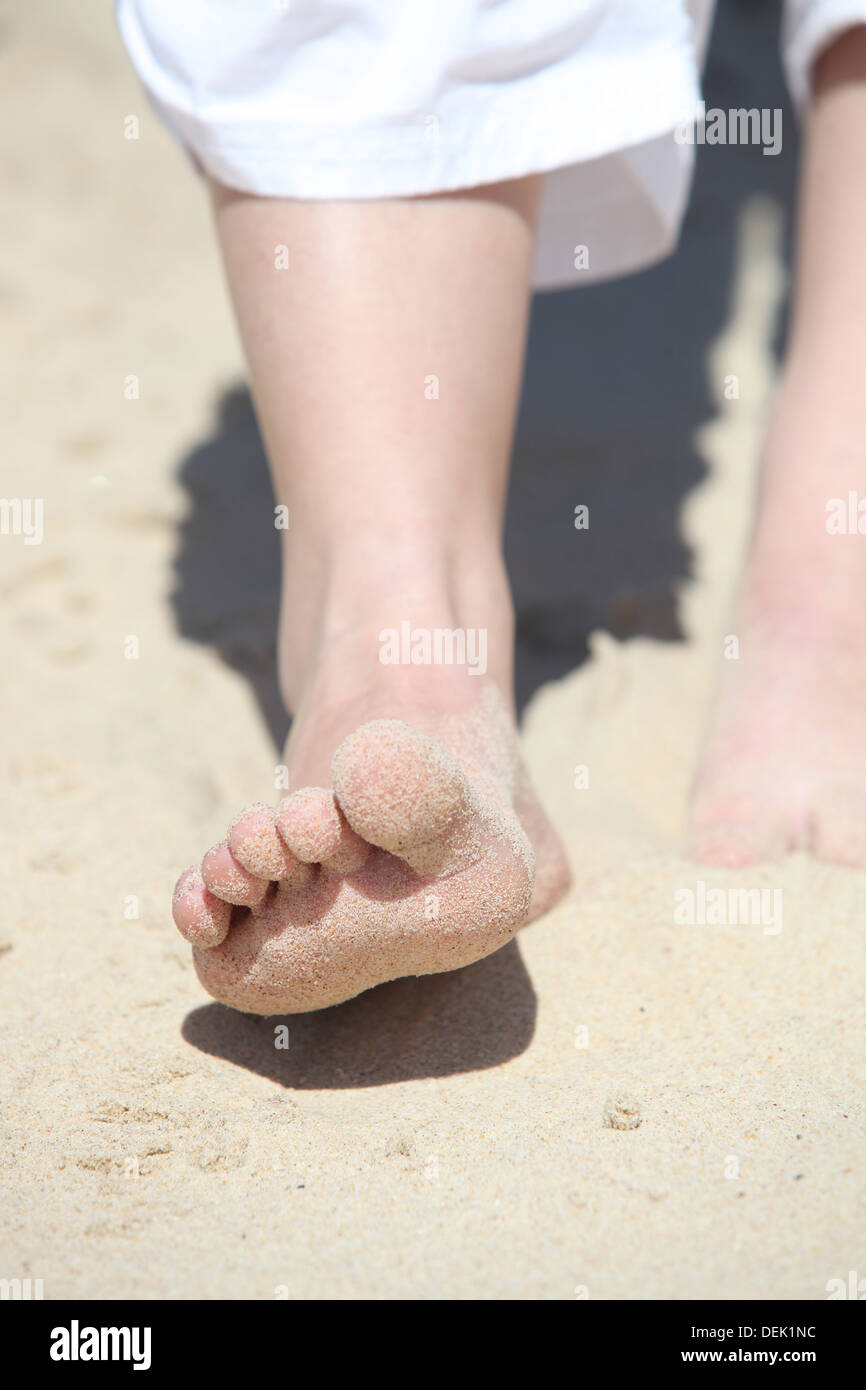 close-up of feet in the sand Stock Photo - Alamy