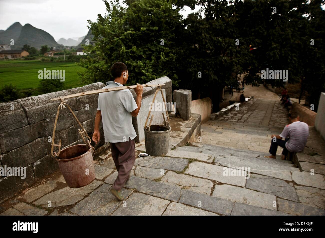 China crossing river carrying hi-res stock photography and images - Alamy