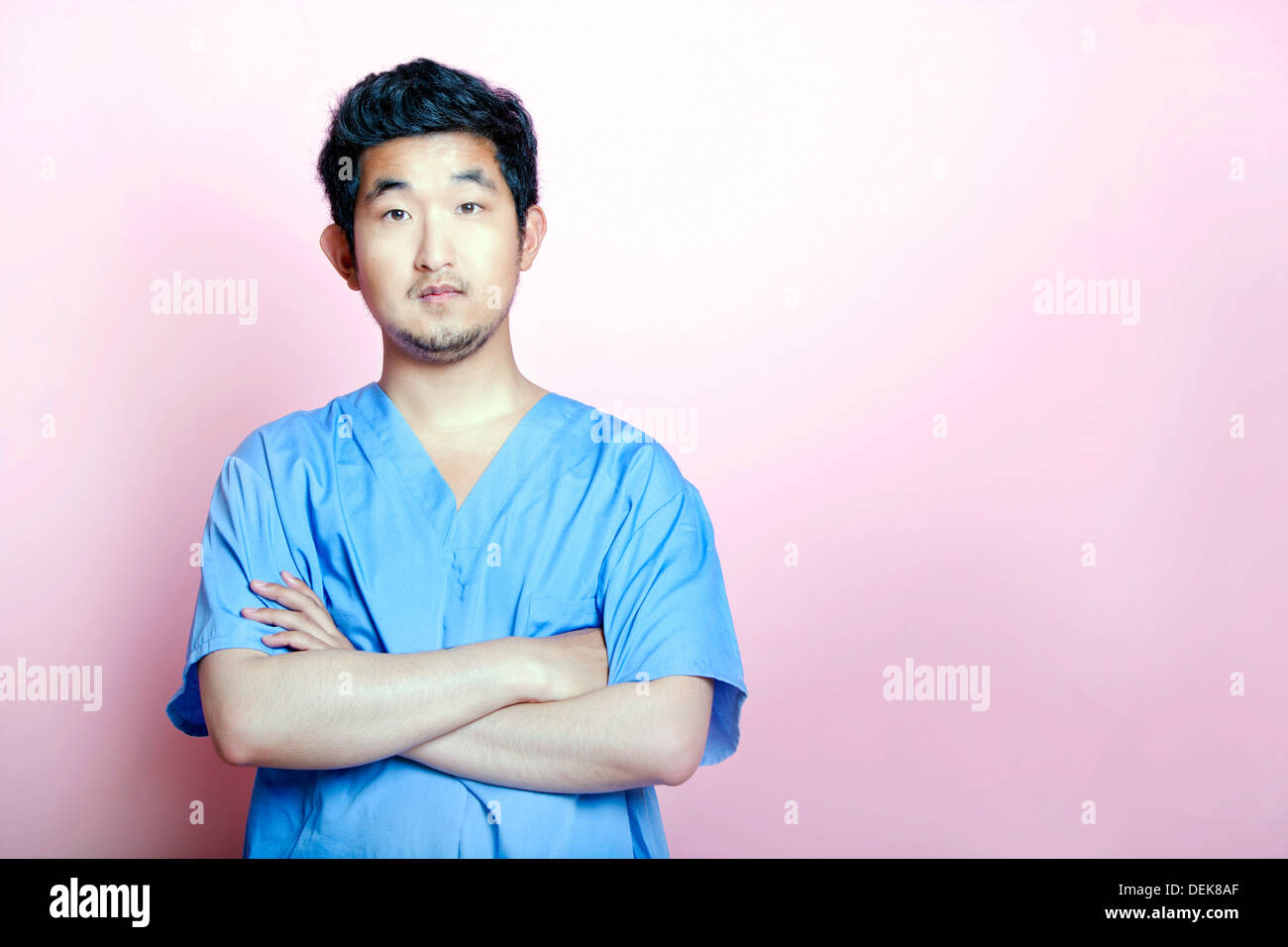 Young Asian Trainee Doctor wearing Scrubs Stock Photo - Alamy