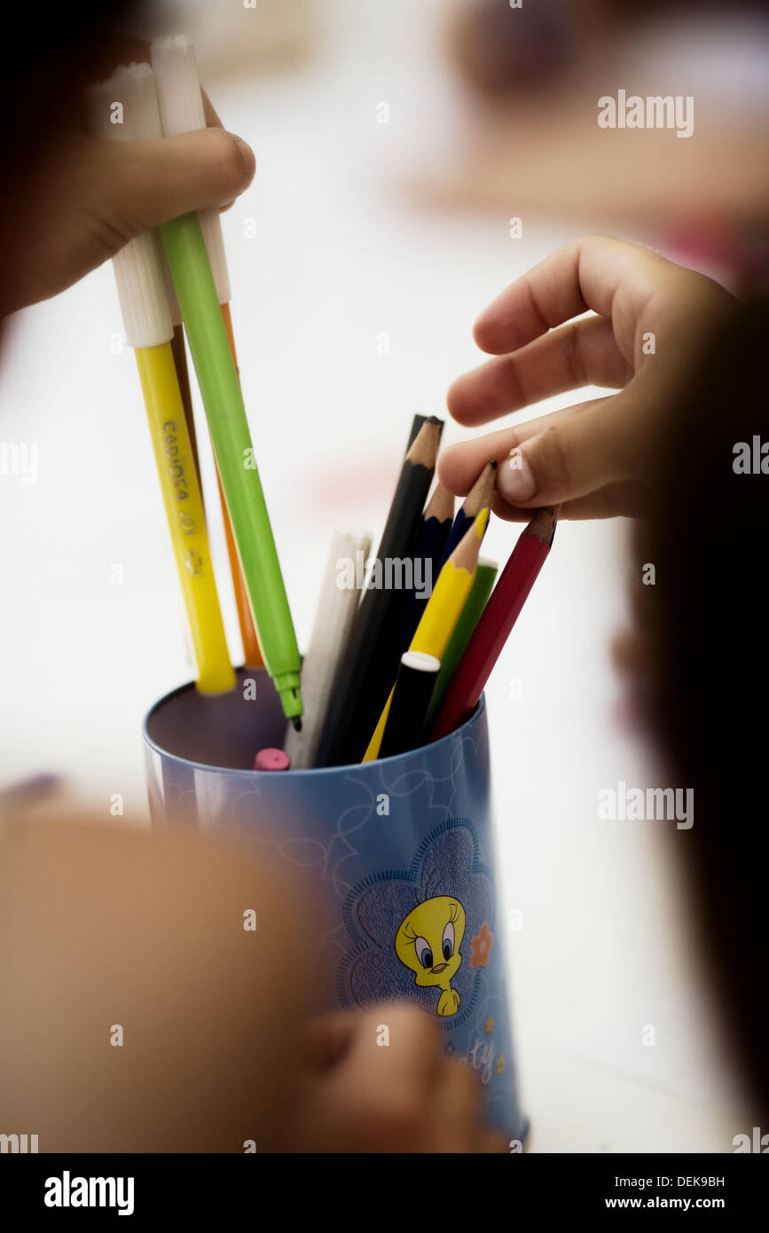 Children´s hands and crayons Stock Photo - Alamy
