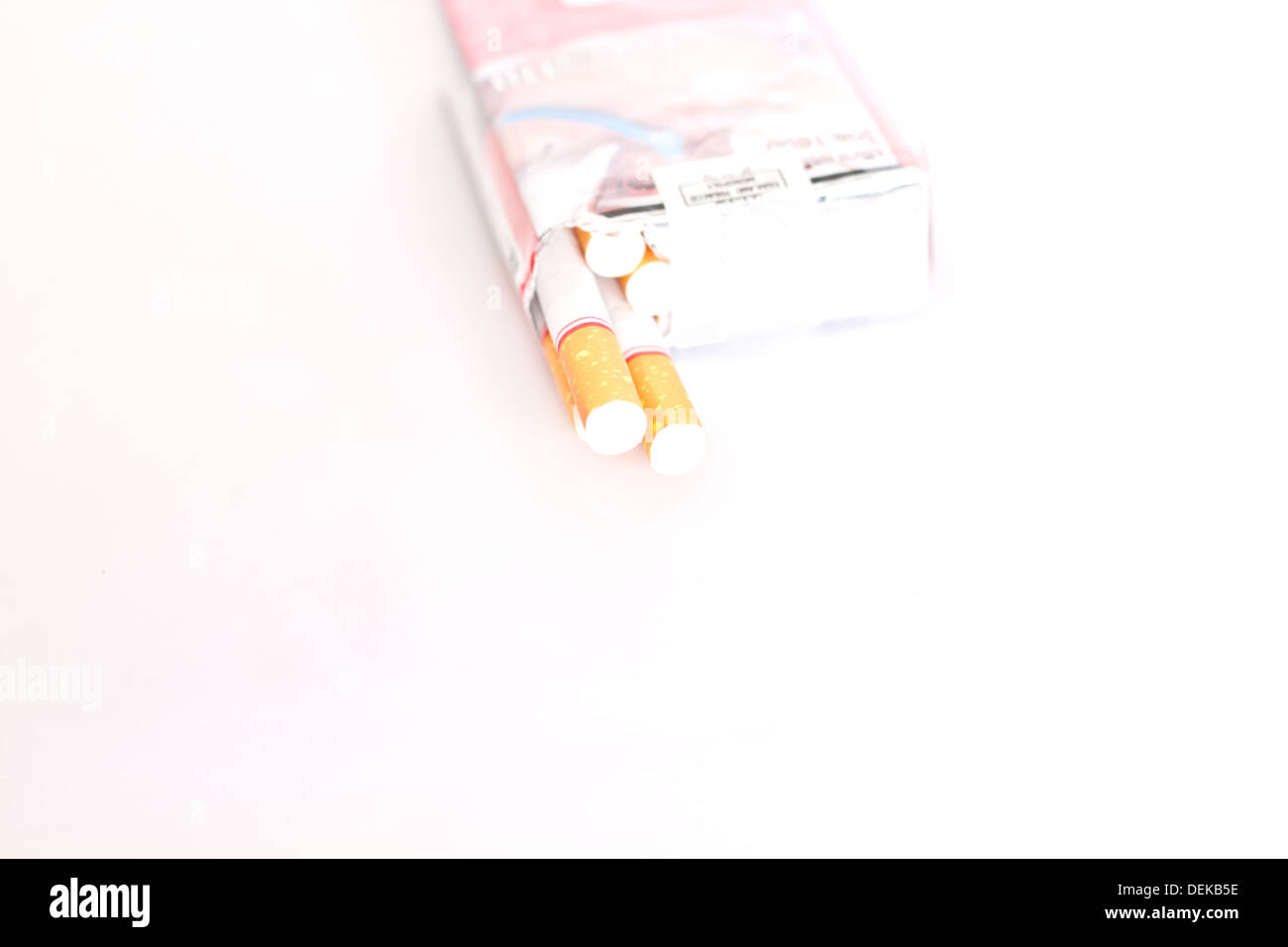 cigarettes on white paper Stock Photo - Alamy