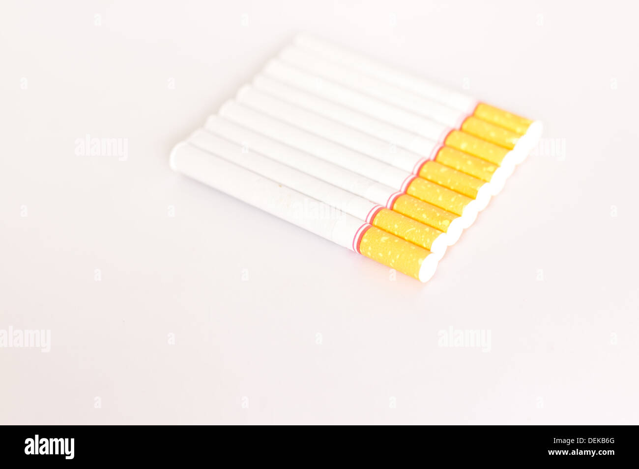 cigarettes on white paper Stock Photo - Alamy