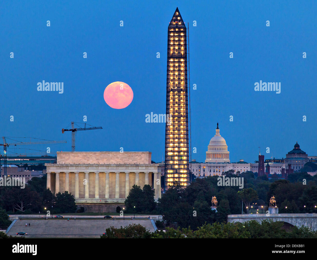 A full moon, known as a Harvest Moon, rises over the Lincoln Memorial ...