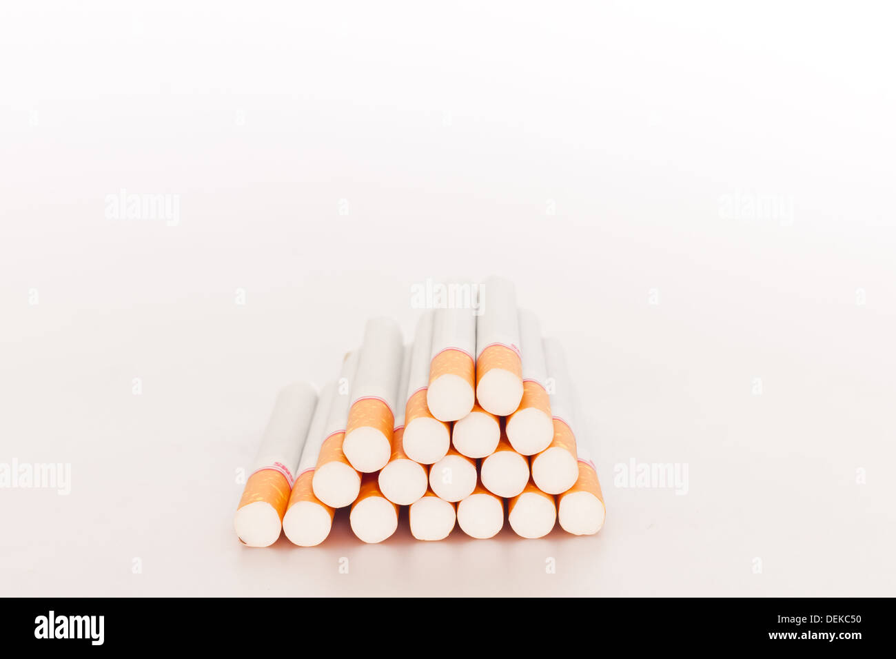 cigarettes on white paper Stock Photo - Alamy