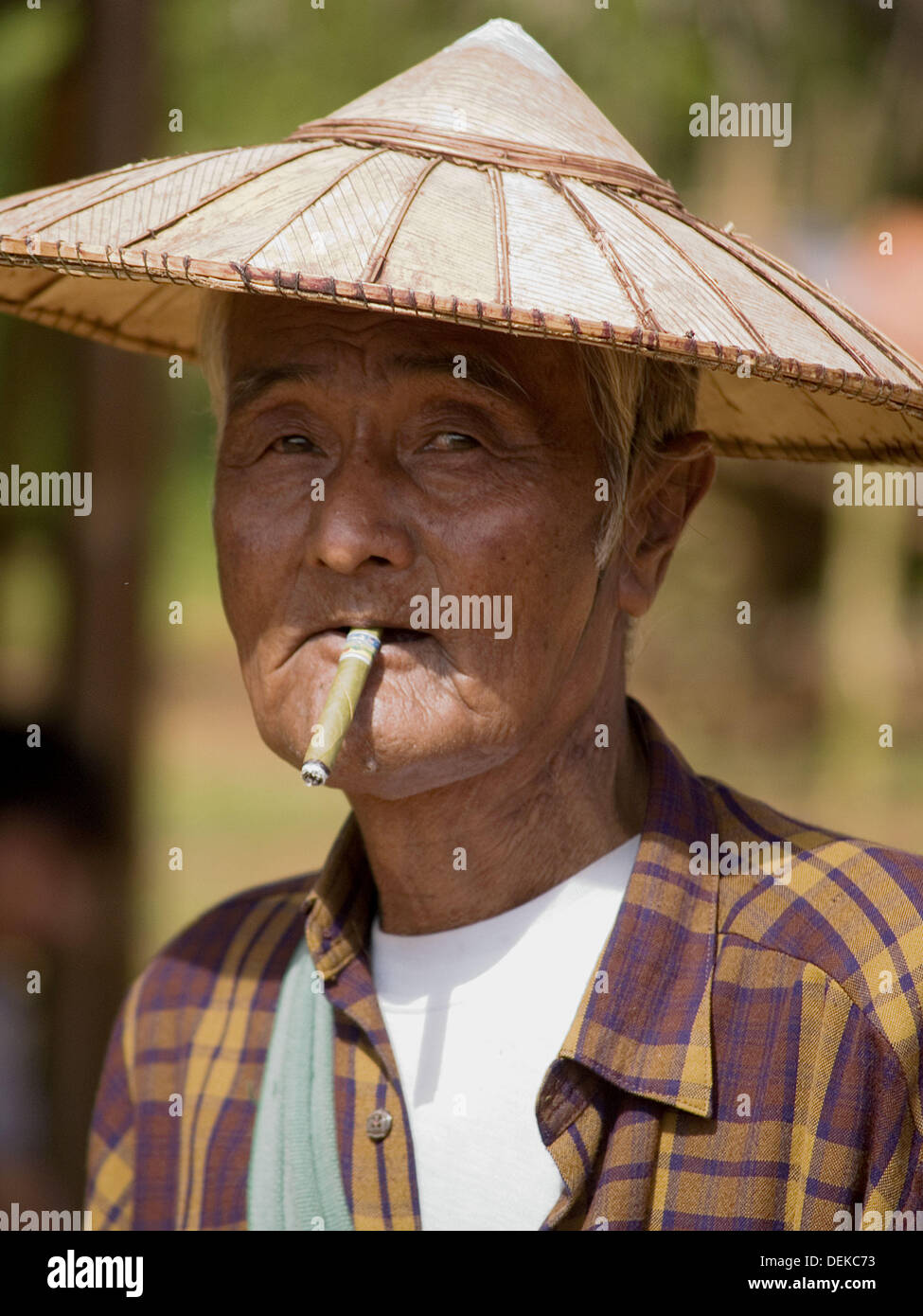 Shan man smoking a cheroot at Inle Lake in Myanmar Stock Photo - Alamy