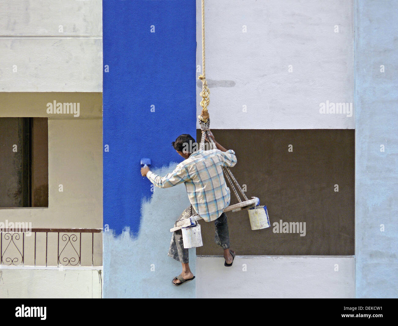 Painter working on building´s exterior hi-res stock photography and ...