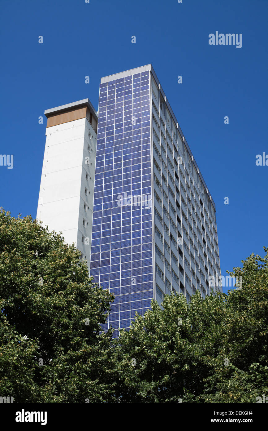 Photovoltaic cells on the side of a high rise housing block on the ...