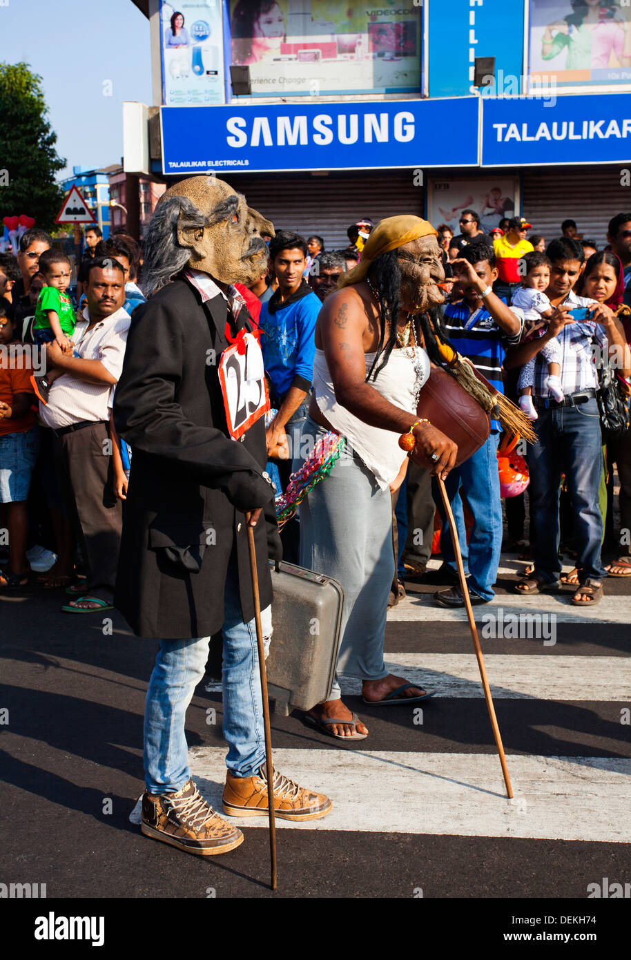 Performers entertaining crowd at procession in a carnival, Goa ...