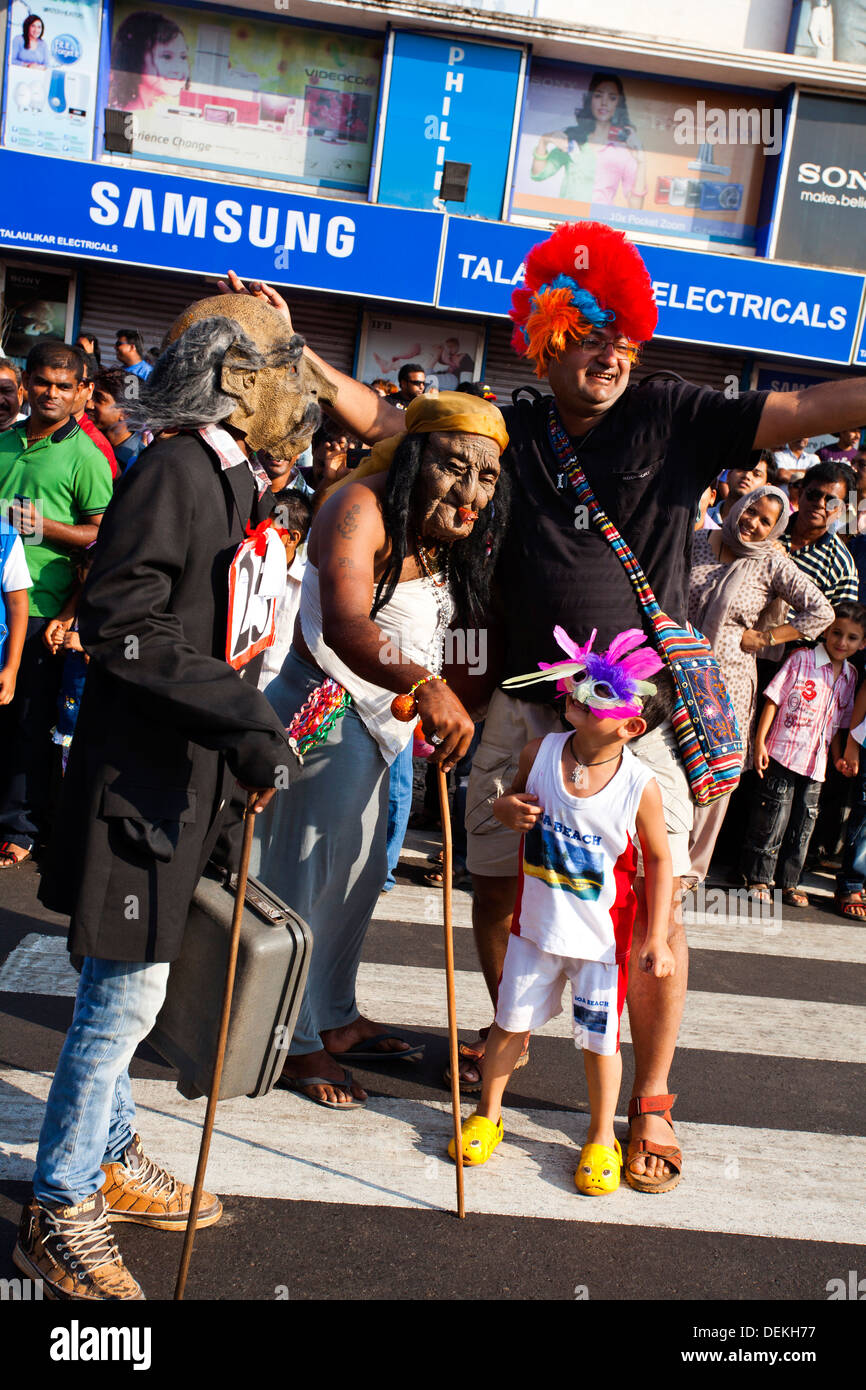 Performers entertaining crowd at procession in a carnival, Goa ...