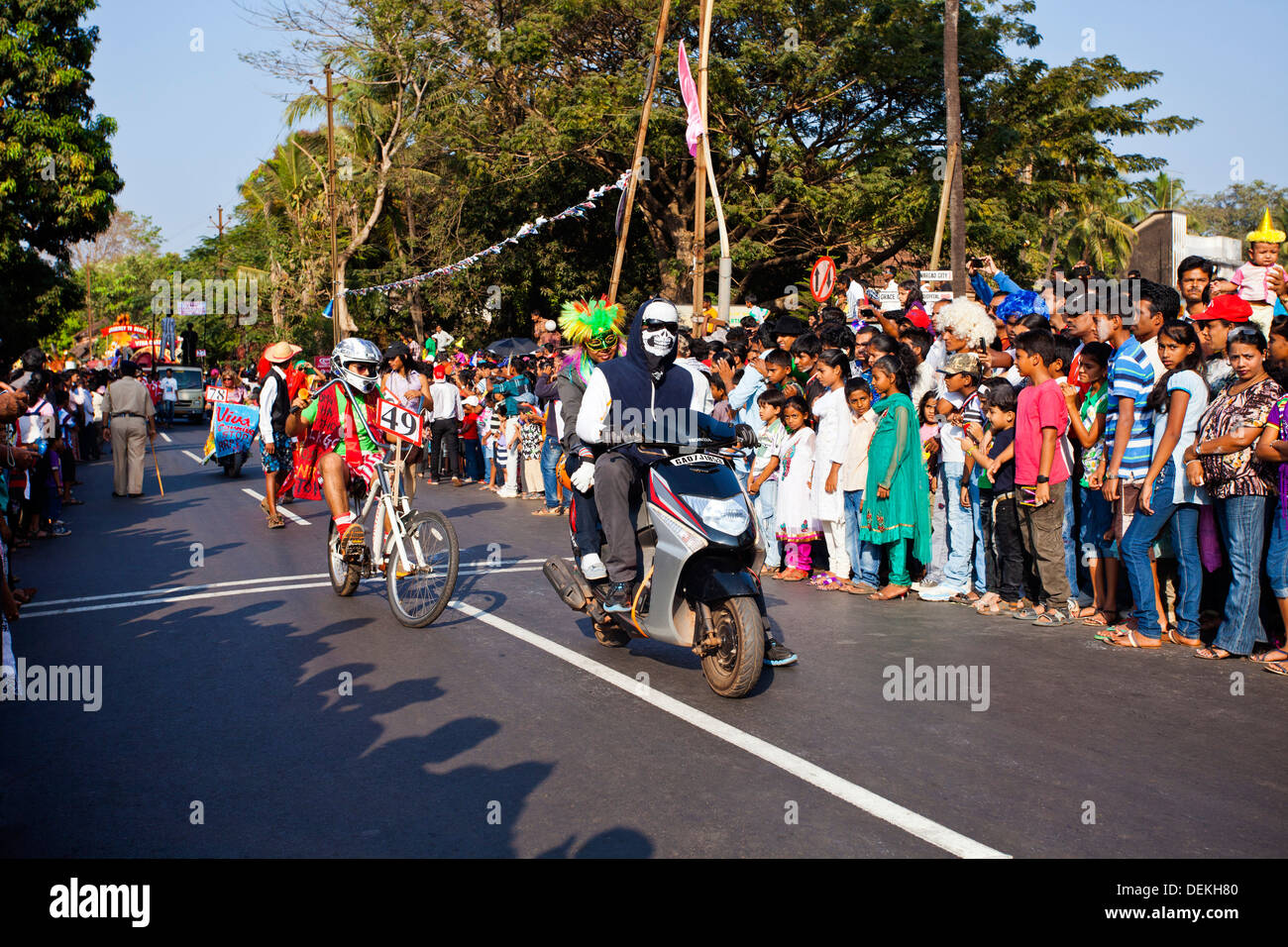 Performers entertaining crowd at procession in a carnival, Goa ...