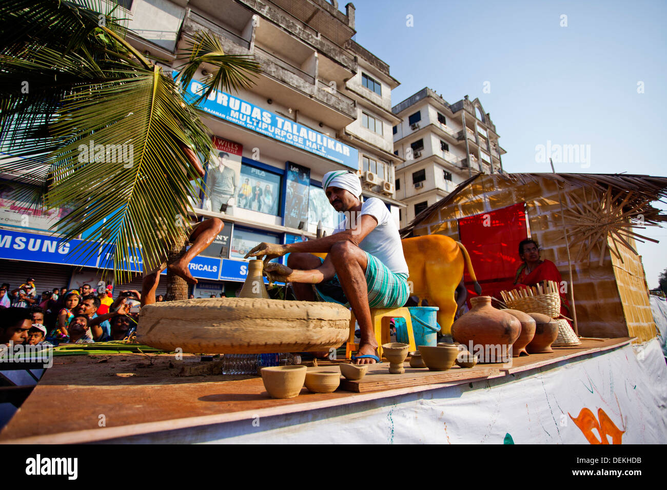 Glimpse showing potter making a pot during procession in a carnival ...