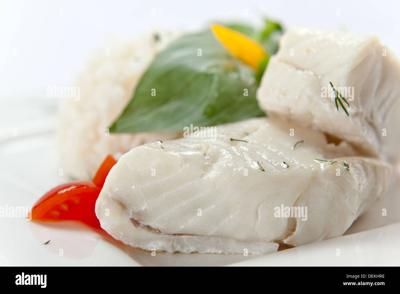 Halibut with greens and vegetables Stock Photo - Alamy