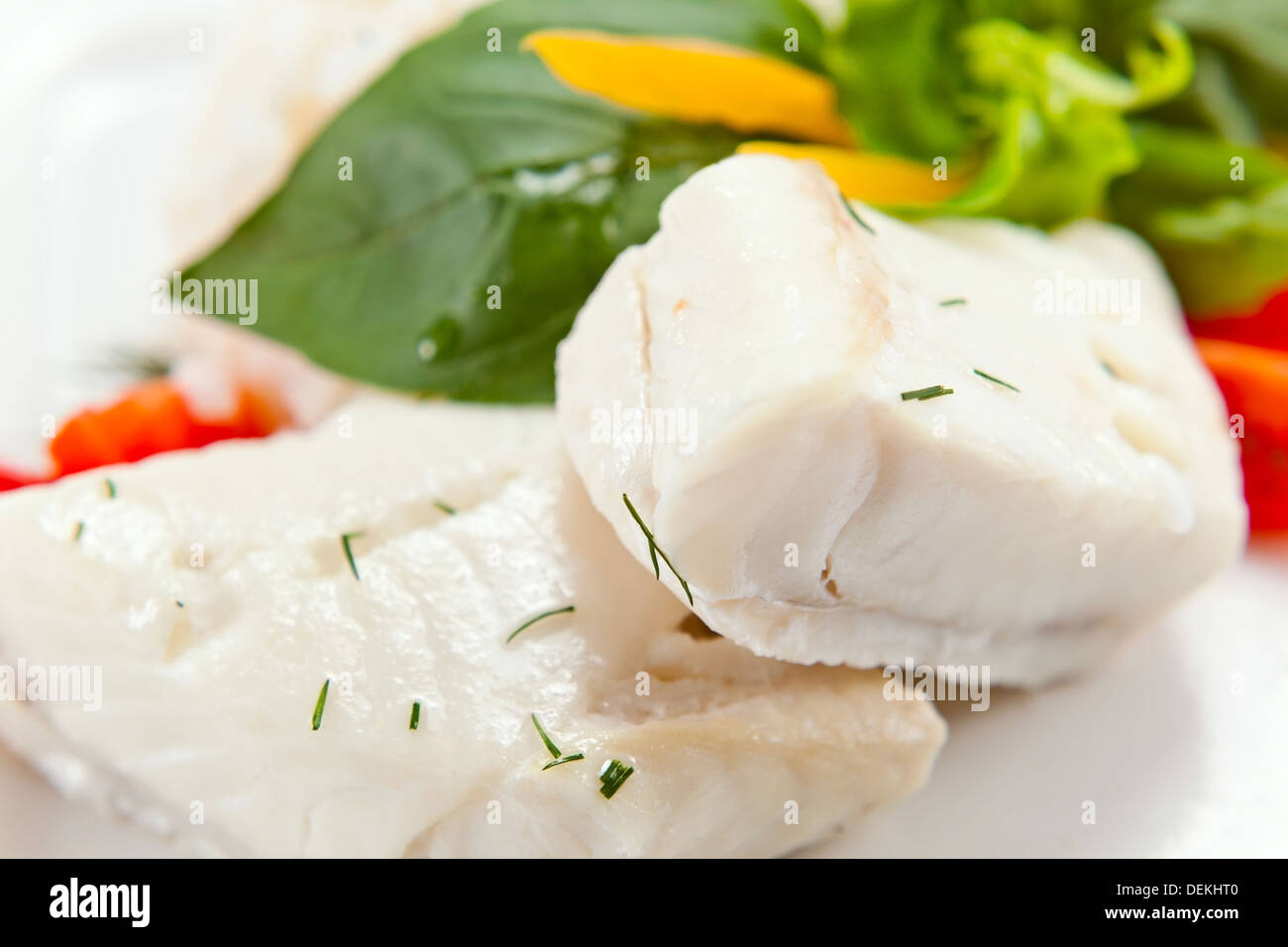 Halibut with greens and vegetables Stock Photo - Alamy