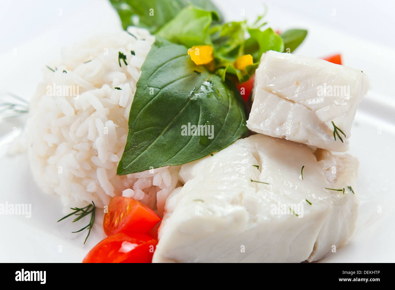 Halibut with greens, rice and vegetables Stock Photo - Alamy
