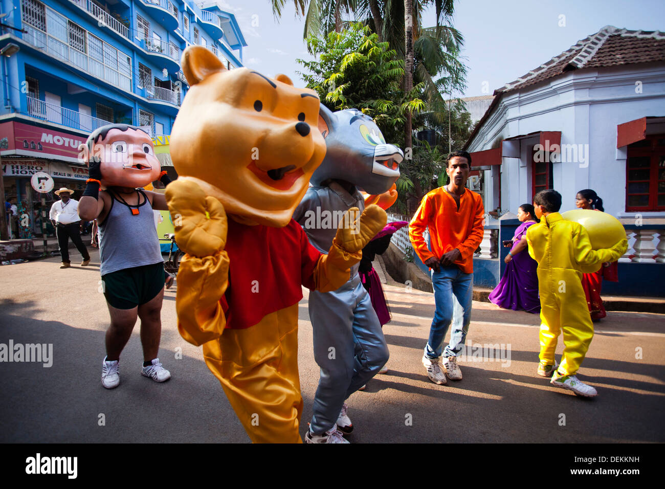 People in costume of cartoon characters during a procession in a ...