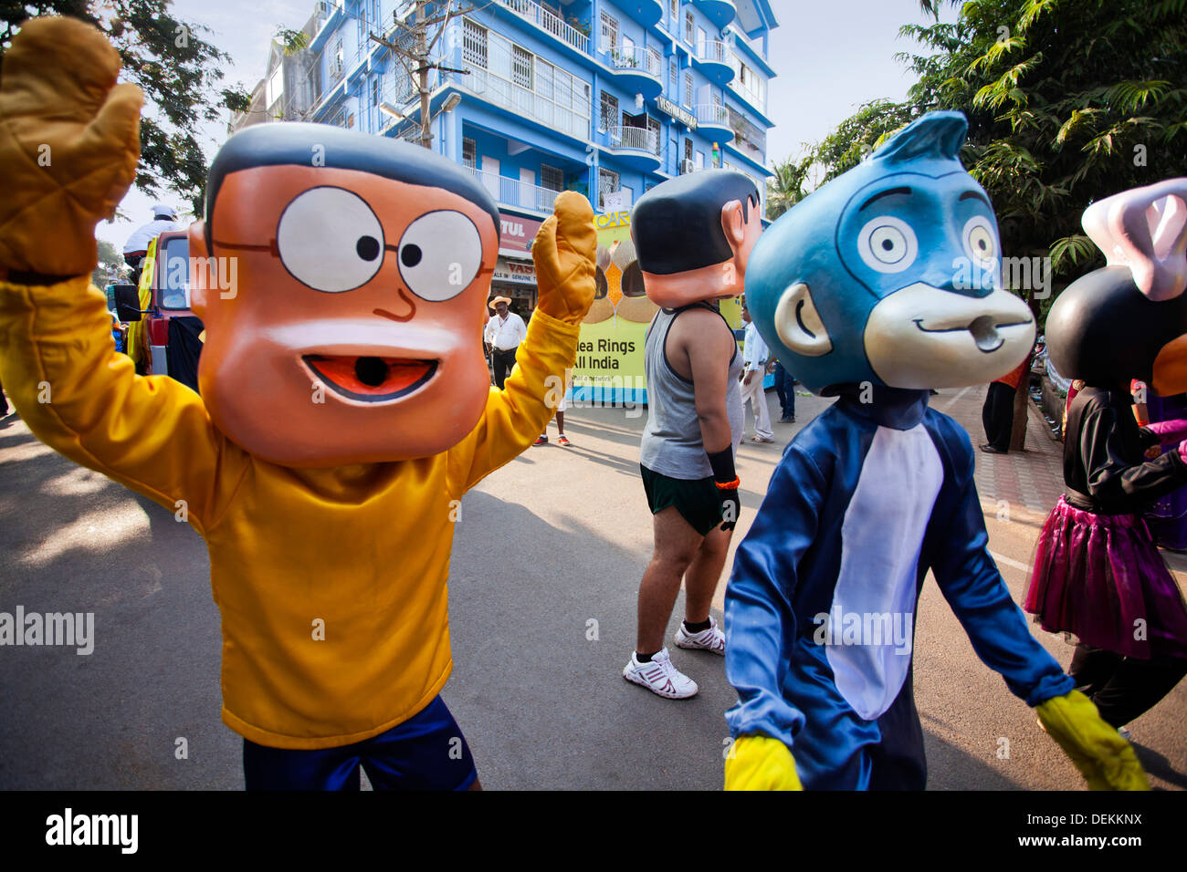 People in costume of cartoon characters during a procession in a ...
