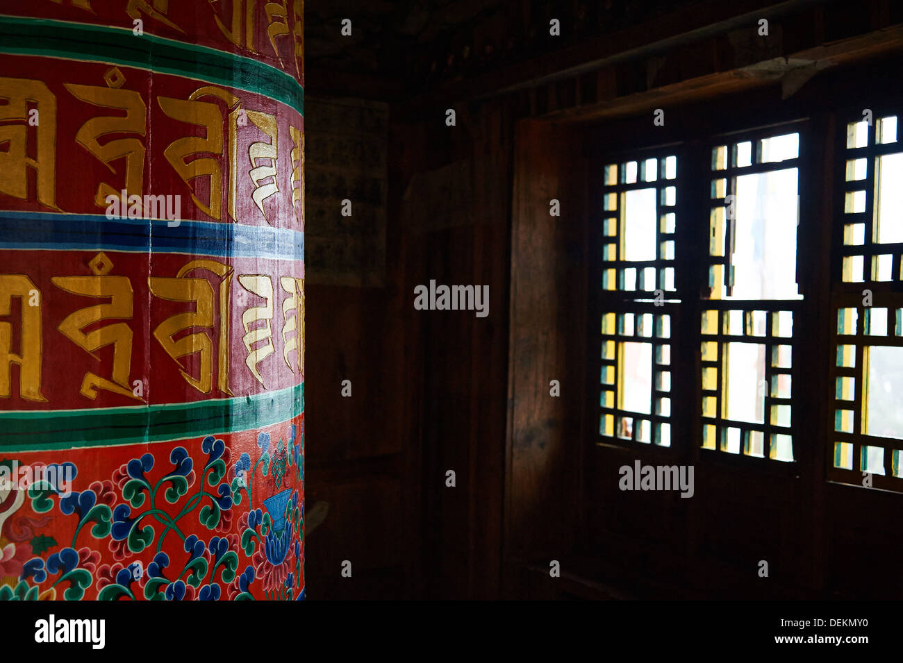 A large prayer wheel graces the entrance to Thulo Gumela, monastery ...