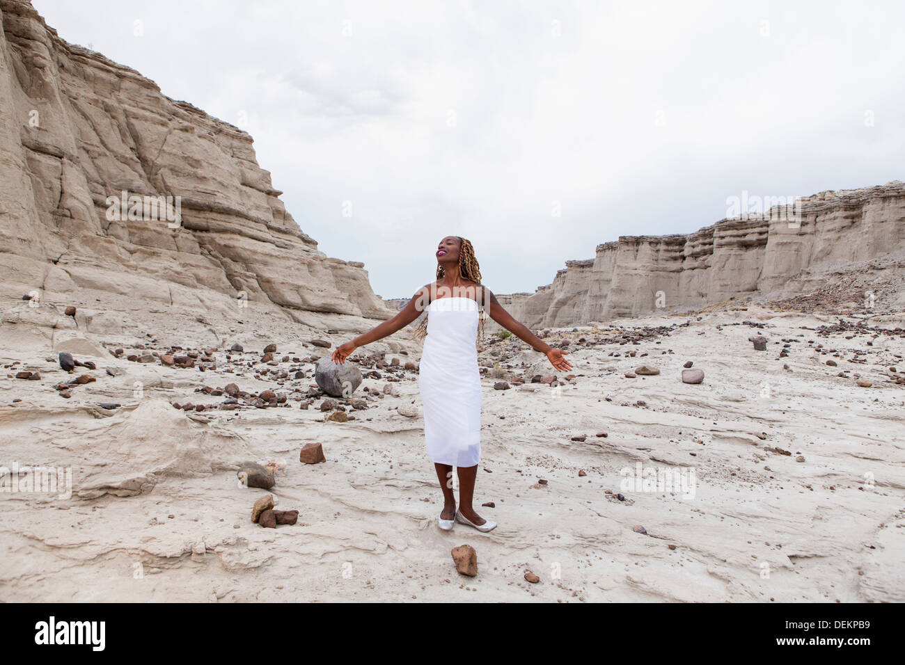African American woman standing in rock formations, Santa Fe, New ...