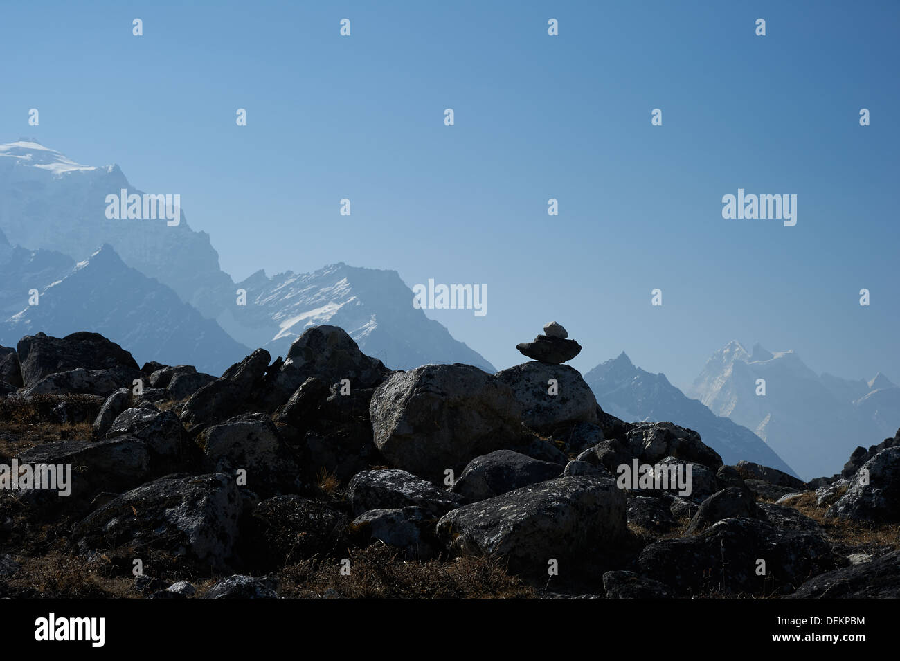 Cairn perched on rock not only marks the path but hikers assemble as a ...
