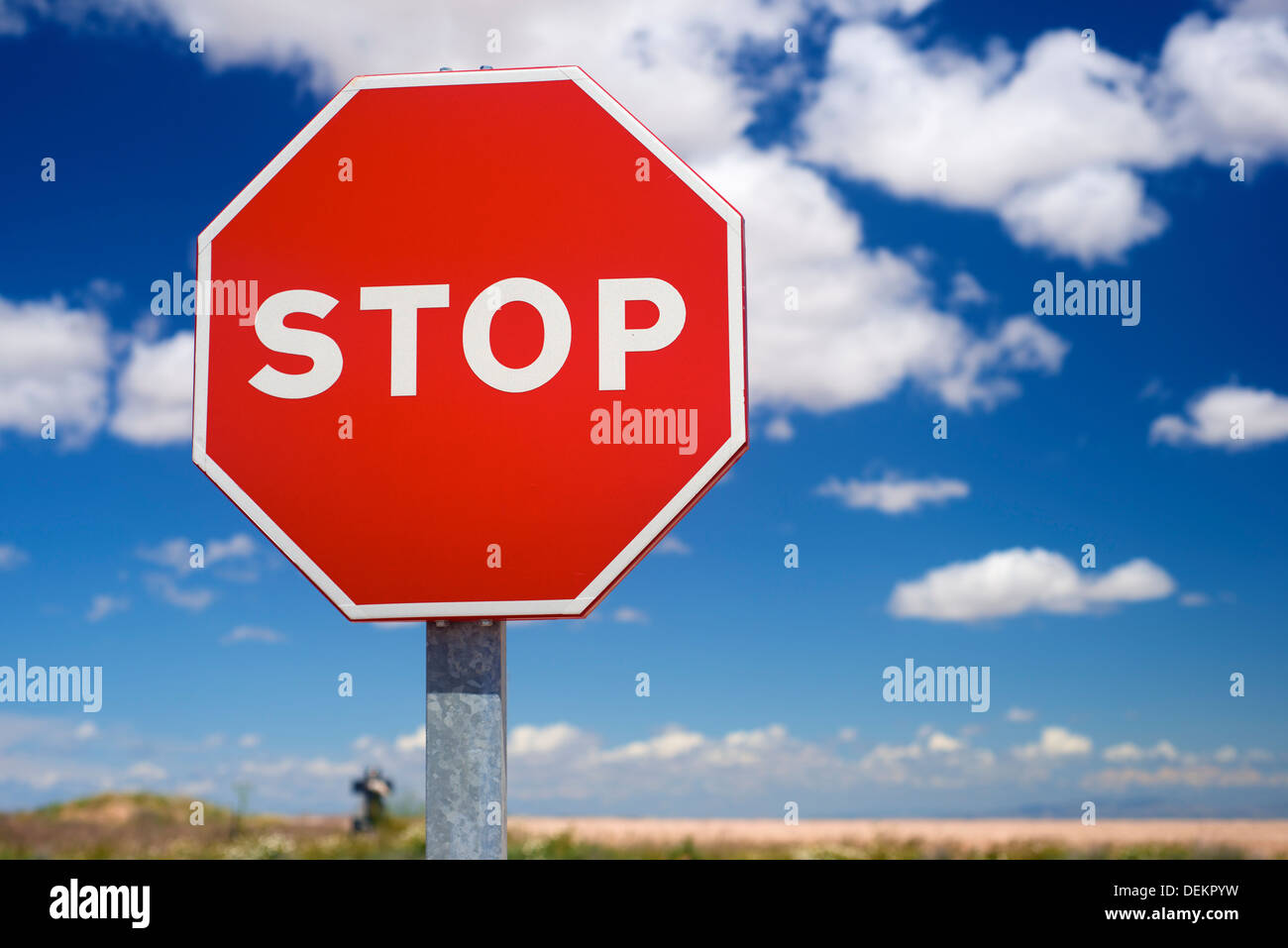 Stop sign and blue sky with white clouds Stock Photo - Alamy