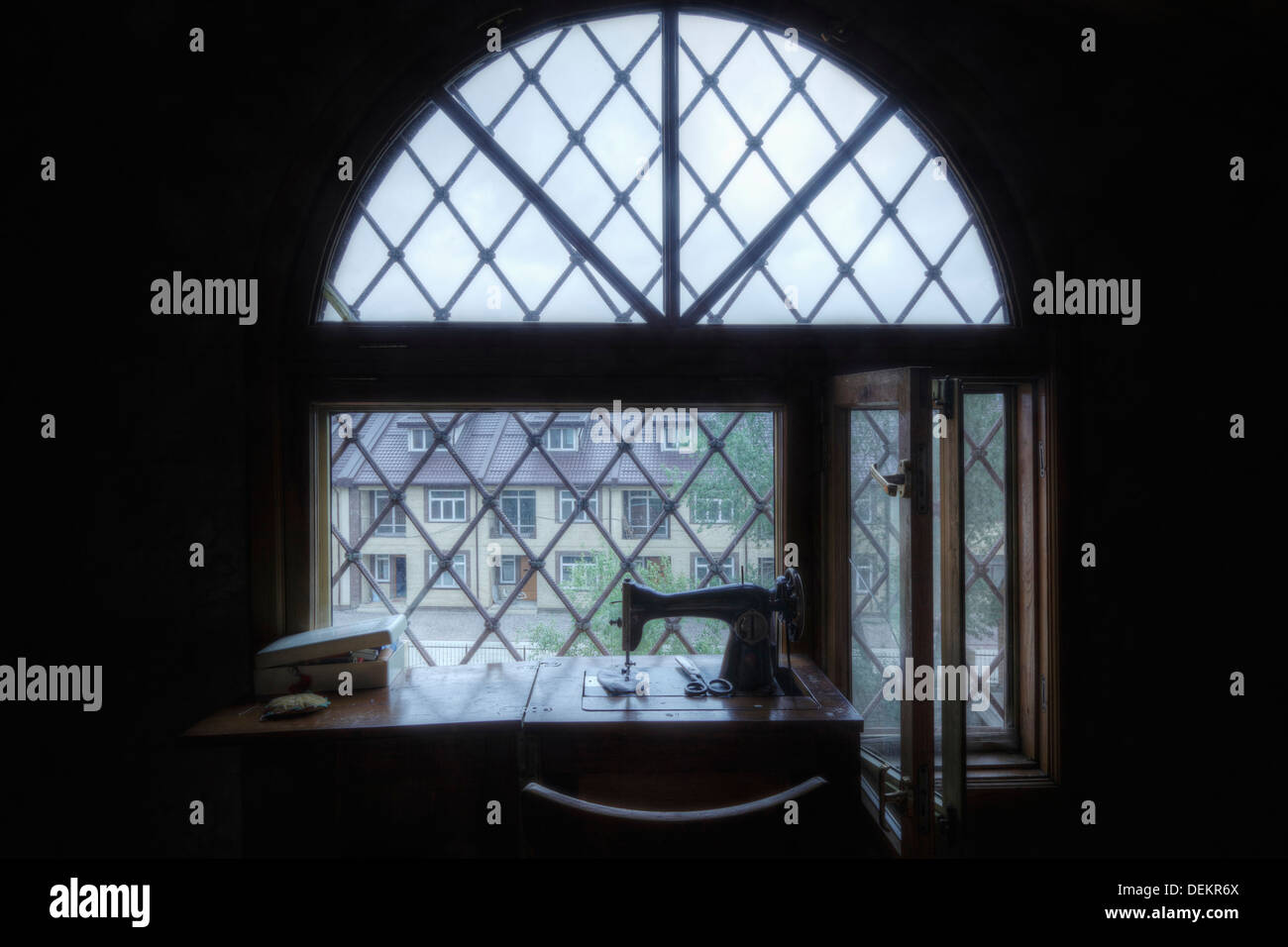 Sewing table at window Stock Photo - Alamy