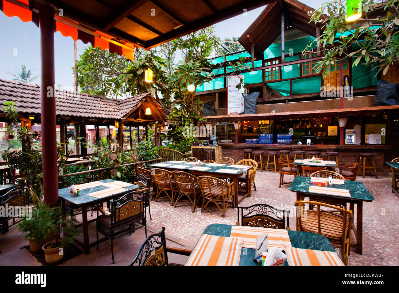 Tables and chairs at a restaurant, The Stone House, Candolim, North Goa ...