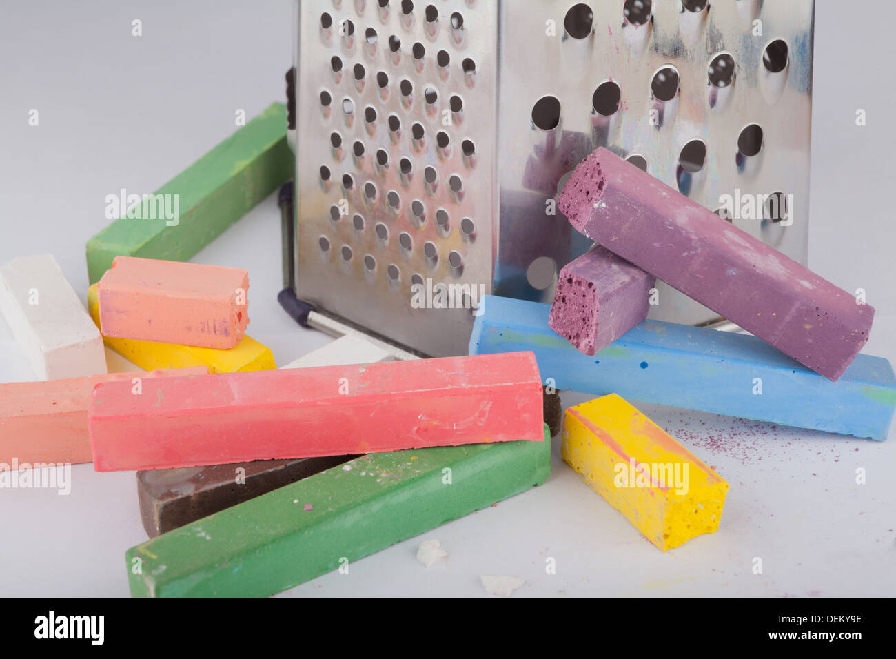 Grater and crayons Stock Photo - Alamy