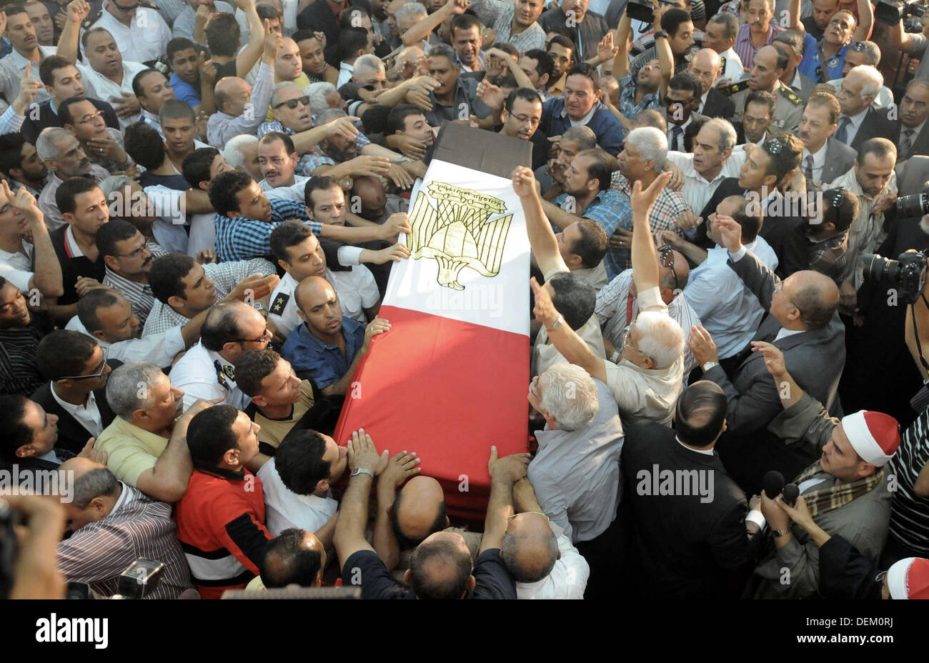 Sept. 20, 2013 - Cairo, Cairo, Egypt - Egyptians carry the coffin of ...