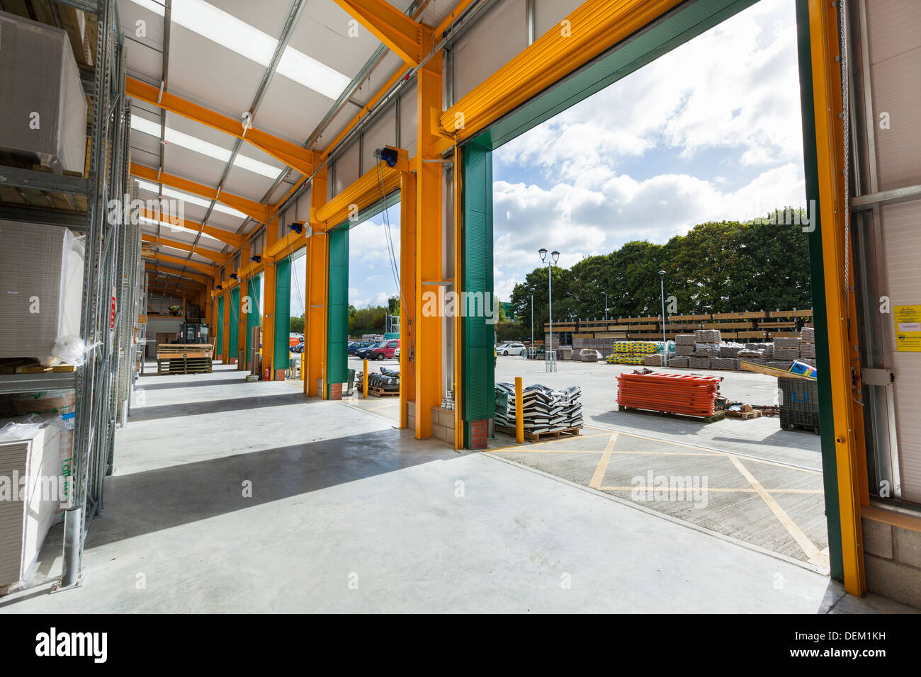 Vehicle access roller doors in builders merchant warehouse Stock Photo ...