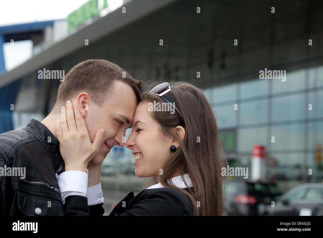 Two happy people at the airport Stock Photo - Alamy