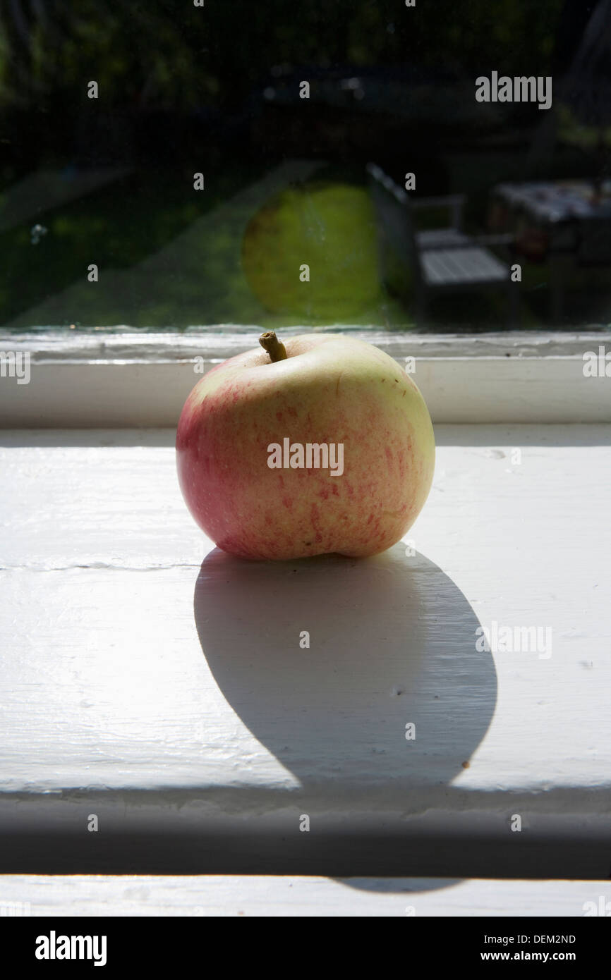 Apple on Window Sill Stock Photo - Alamy