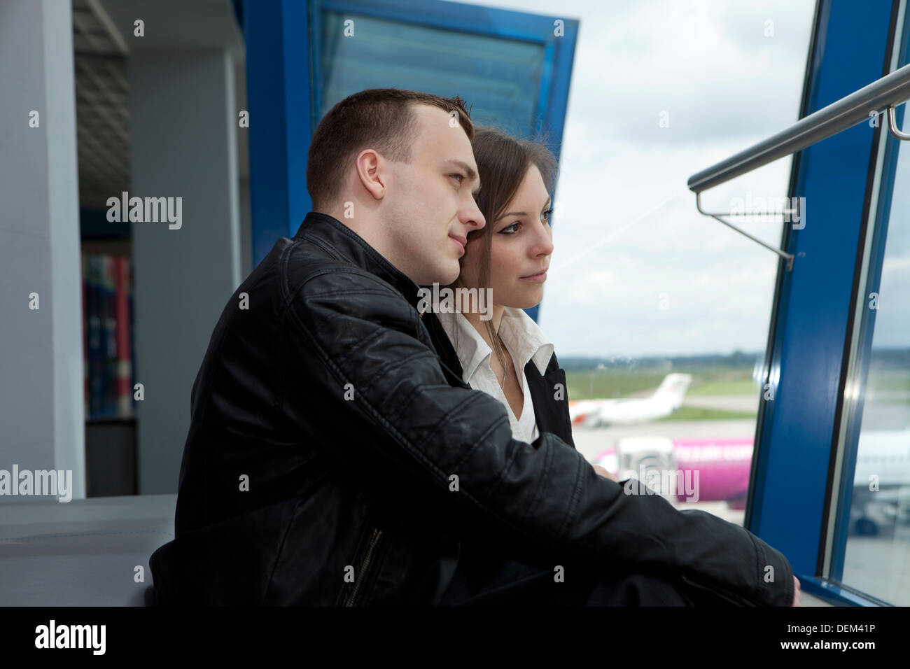 Two people waiting on a plane Stock Photo - Alamy