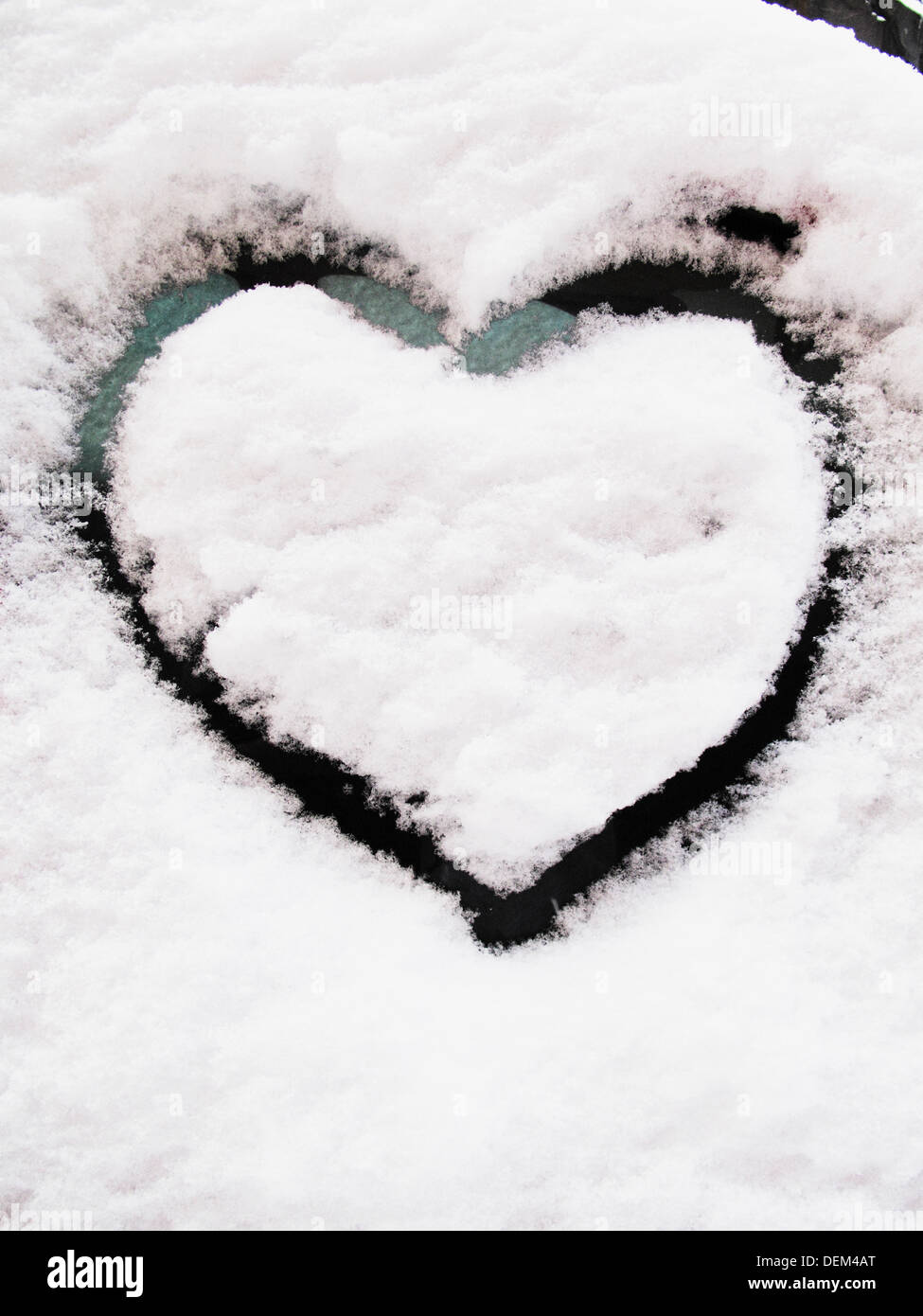 Heart Shape in Snow Stock Photo - Alamy