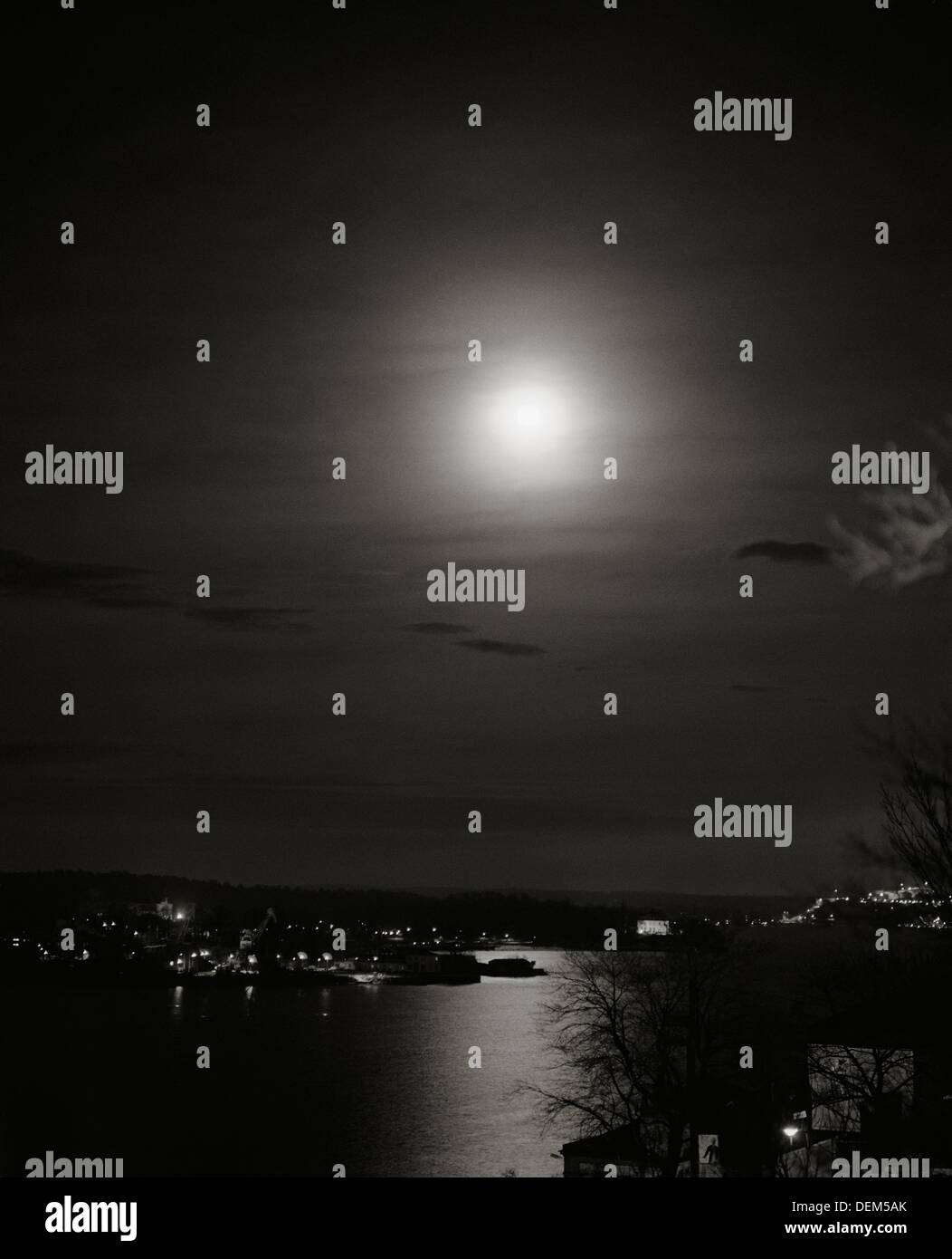 Moonlight Over Village Harbor Stock Photo - Alamy