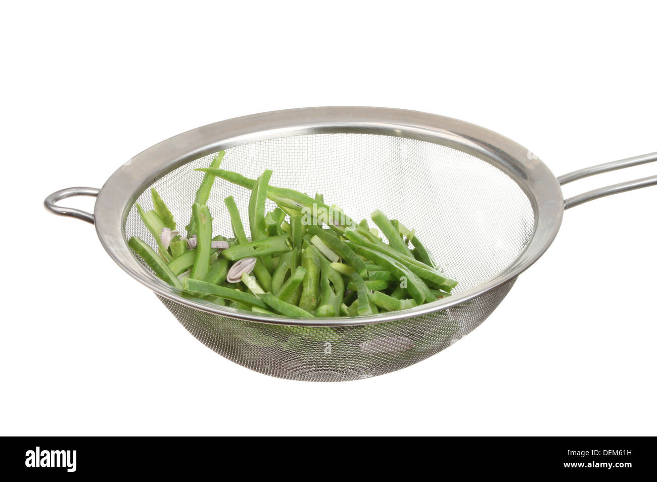 Green runner beans in a stainless steel sieve isolated against white ...