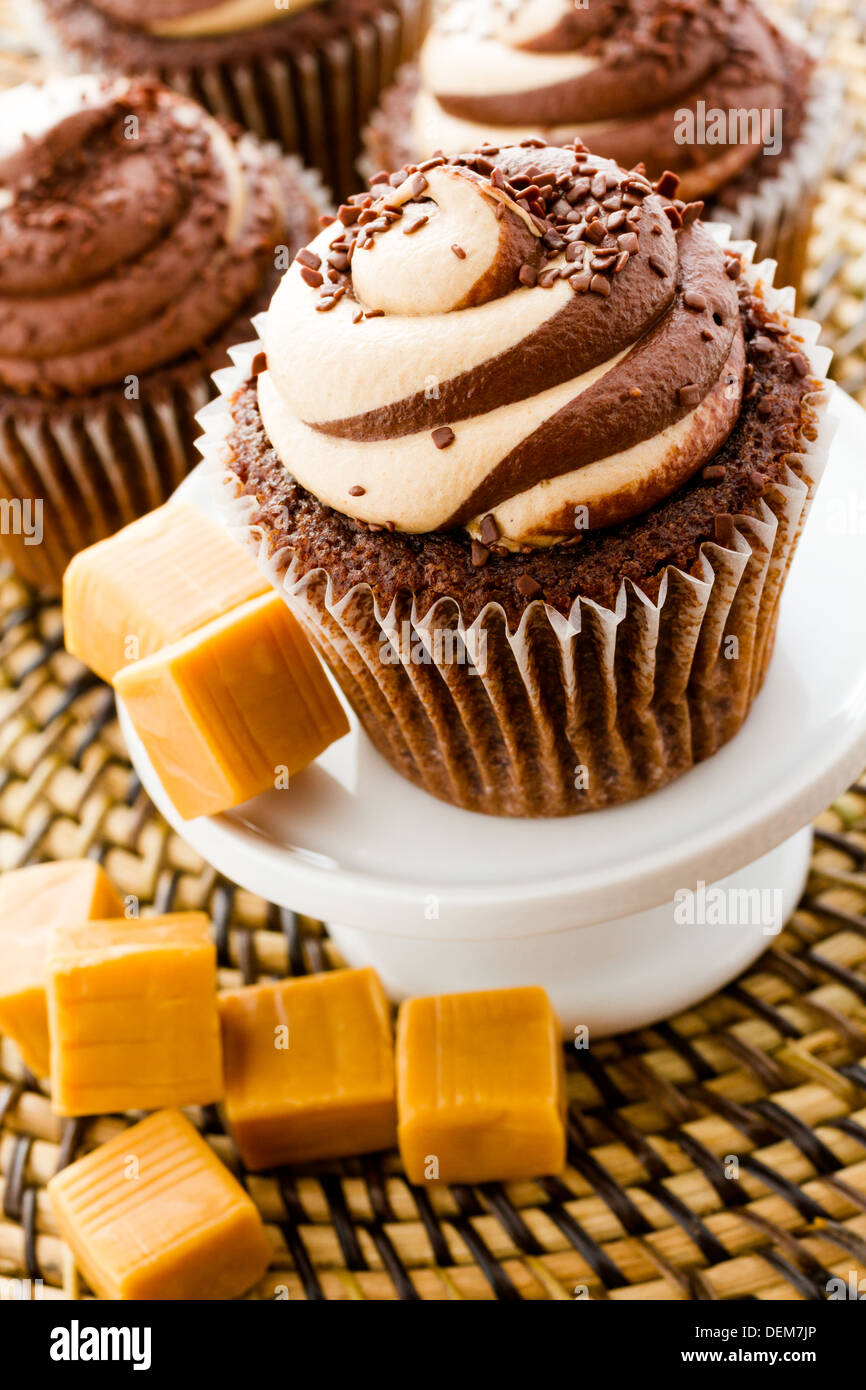 Gourmet chocolate caramel swirl cupcake with chocolate sprikles Stock Photo - Alamy