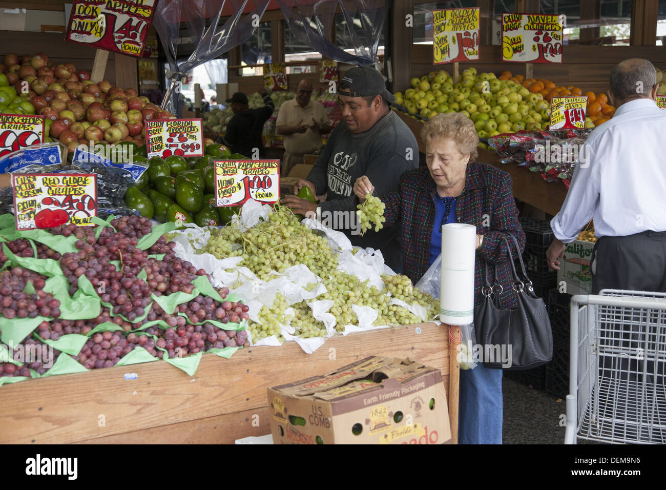 People shop at a large produce market in Sunset Park a highly ...
